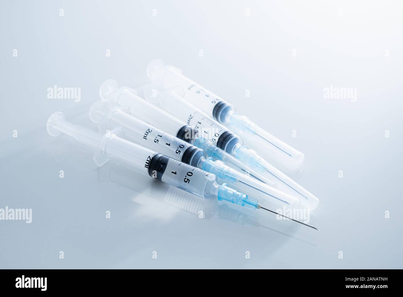 Syringes in clean medical background. Concept of injection drugs ...