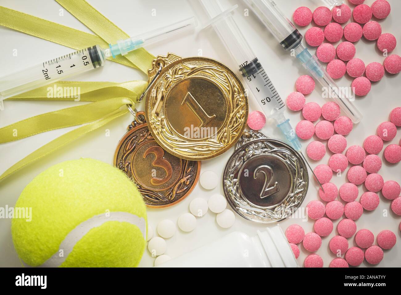 Pile of drugs in pills and injections and sports medals. Concepts of ...