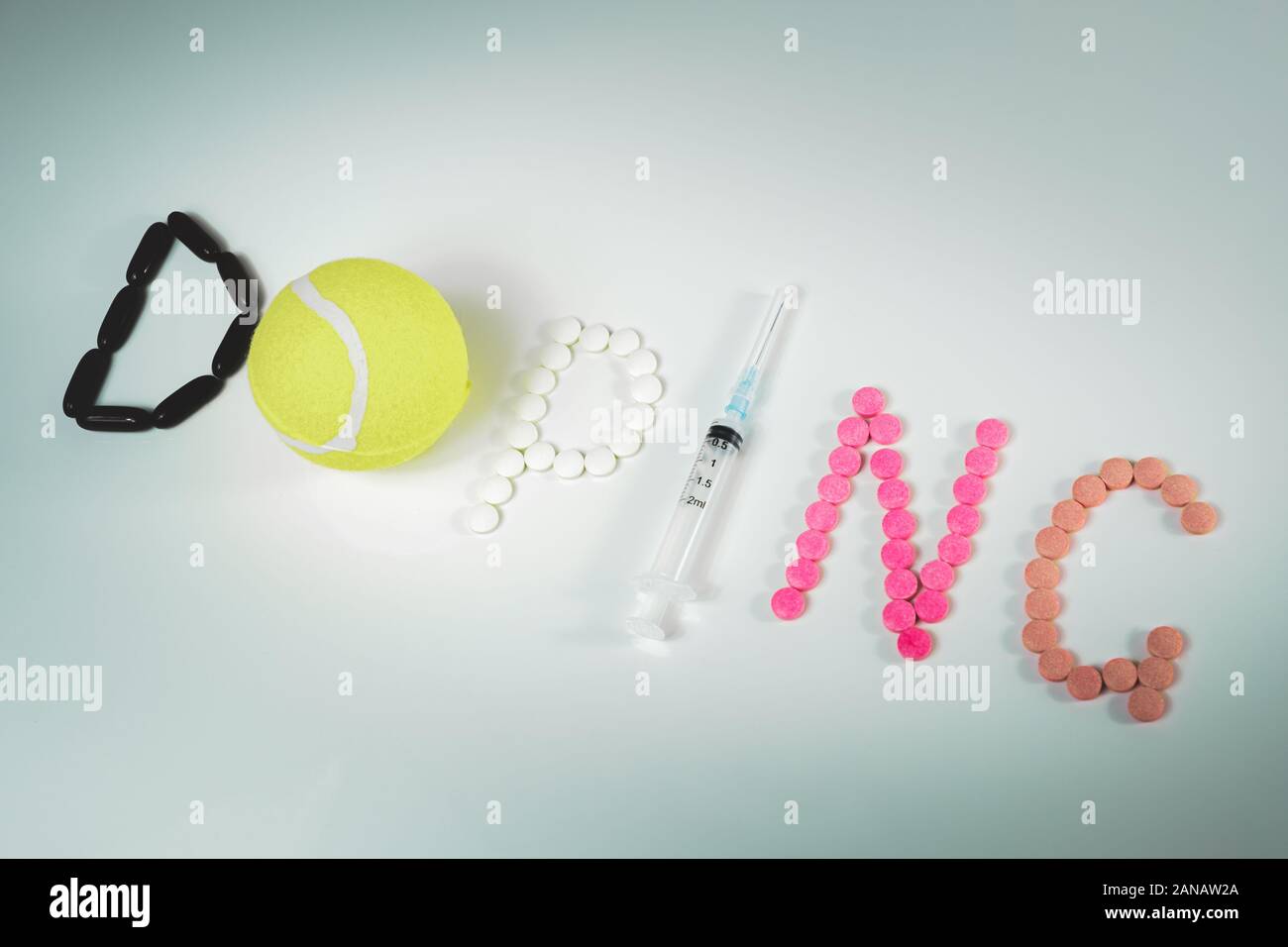 "Doping" word made of pills, tablets, syringe and a tennis ball ...
