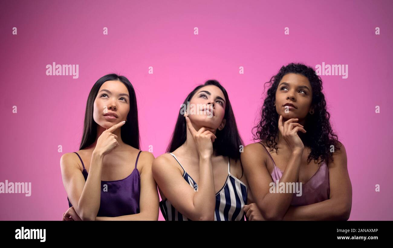 Pretty women thinking on pink background, dreaming about successful ...