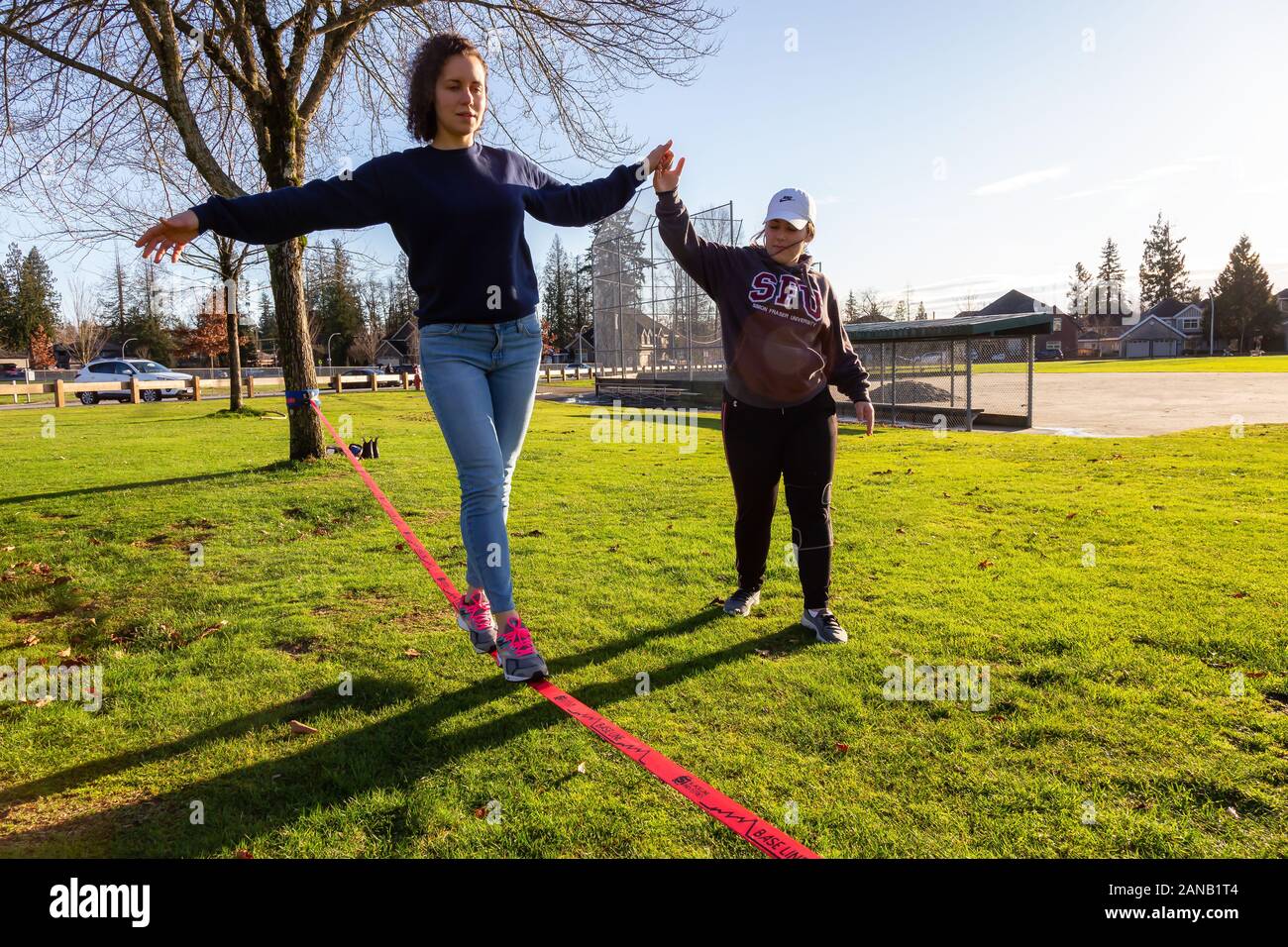 Woman slacklining practice in hi-res stock photography and images - Alamy