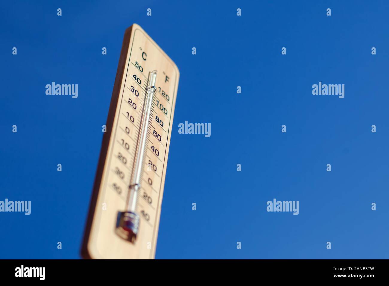 Thermometer on the blue sky background. Weather forecast and outdoor ...