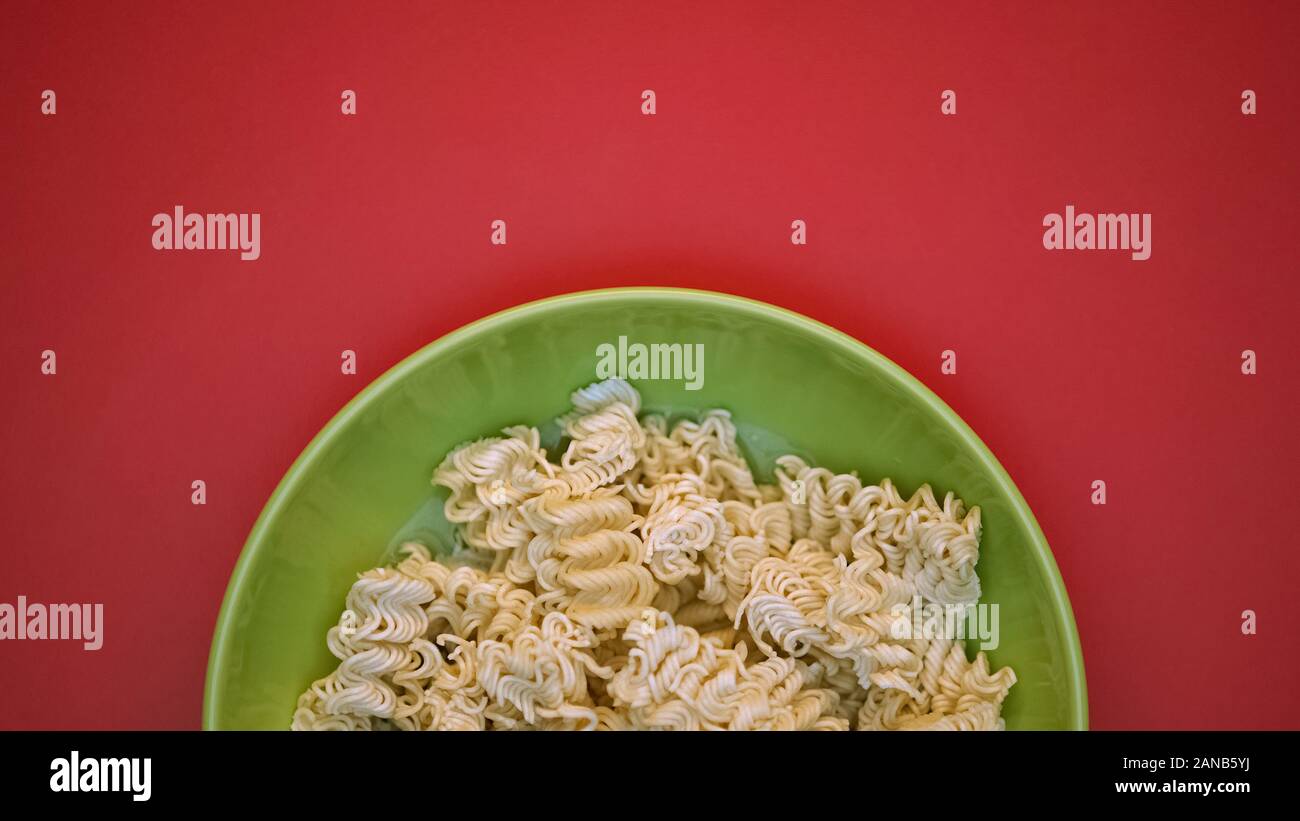 Instant chinese noodles on red background hi-res stock photography and ...