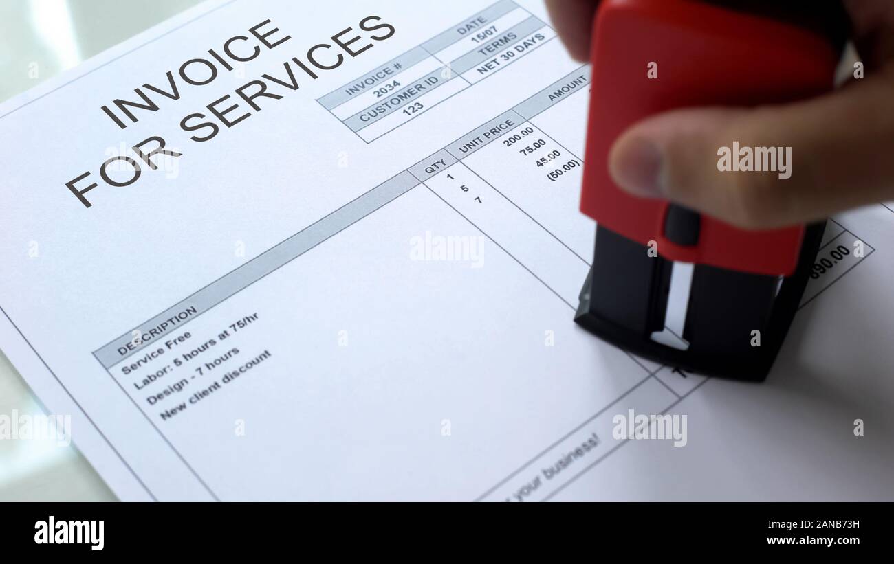 Invoice for services, hand stamping rectangular seal on commercial ...