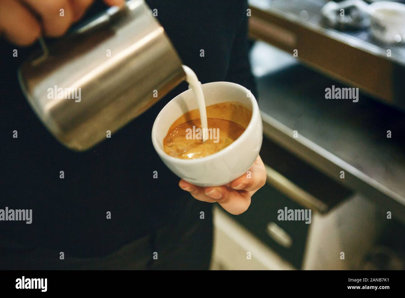Barista pours milk cup coffee hi-res stock photography and images - Alamy