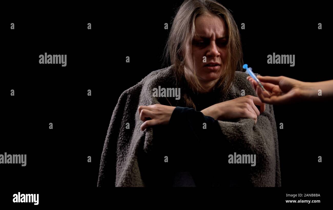 Hand tempting addict lady with drug dose, woman suffering withdrawal ...