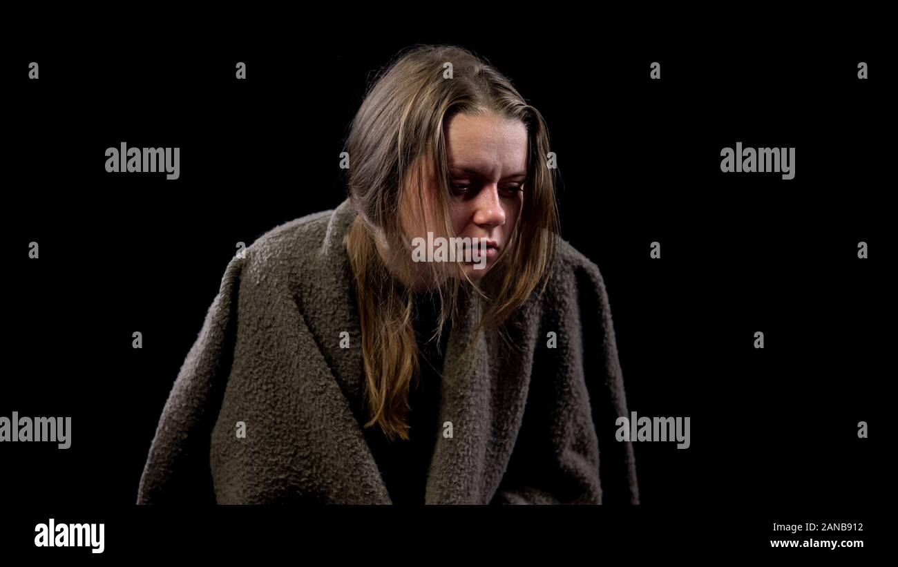 Sick homeless woman covered with blanket, suffering pain, contagious ...