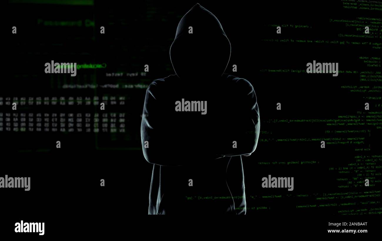 Anonymous hacker in hoodie with arms crossed on numbers and codes ...