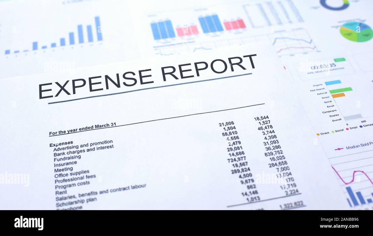 Expense report lying on table, graphs charts and diagrams, official ...
