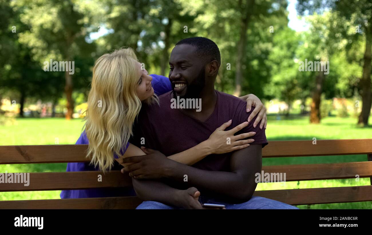 Couple hugging from behind laughing hi-res stock photography and images ...