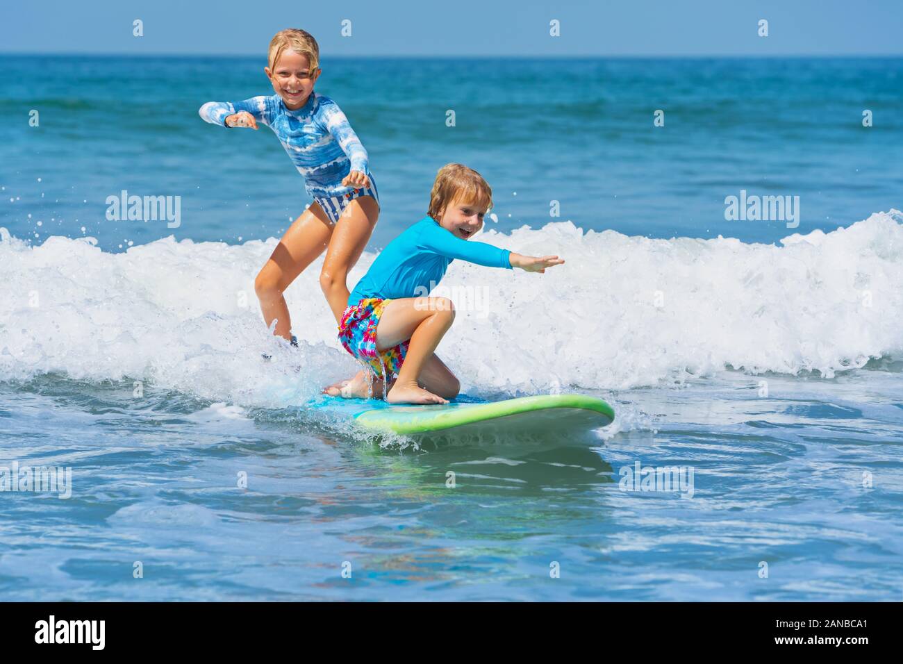 Boy and girl surfers hi-res stock photography and images - Alamy