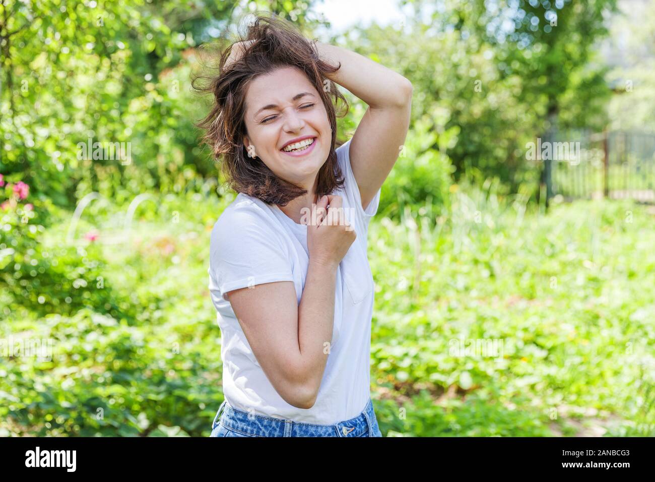 Happy girl smiling outdoor. Beautiful young brunete woman with brown ...