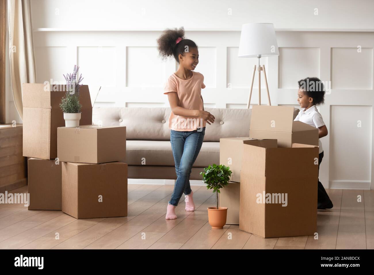 Happy african american kids playing near cardboard boxes Stock Photo ...