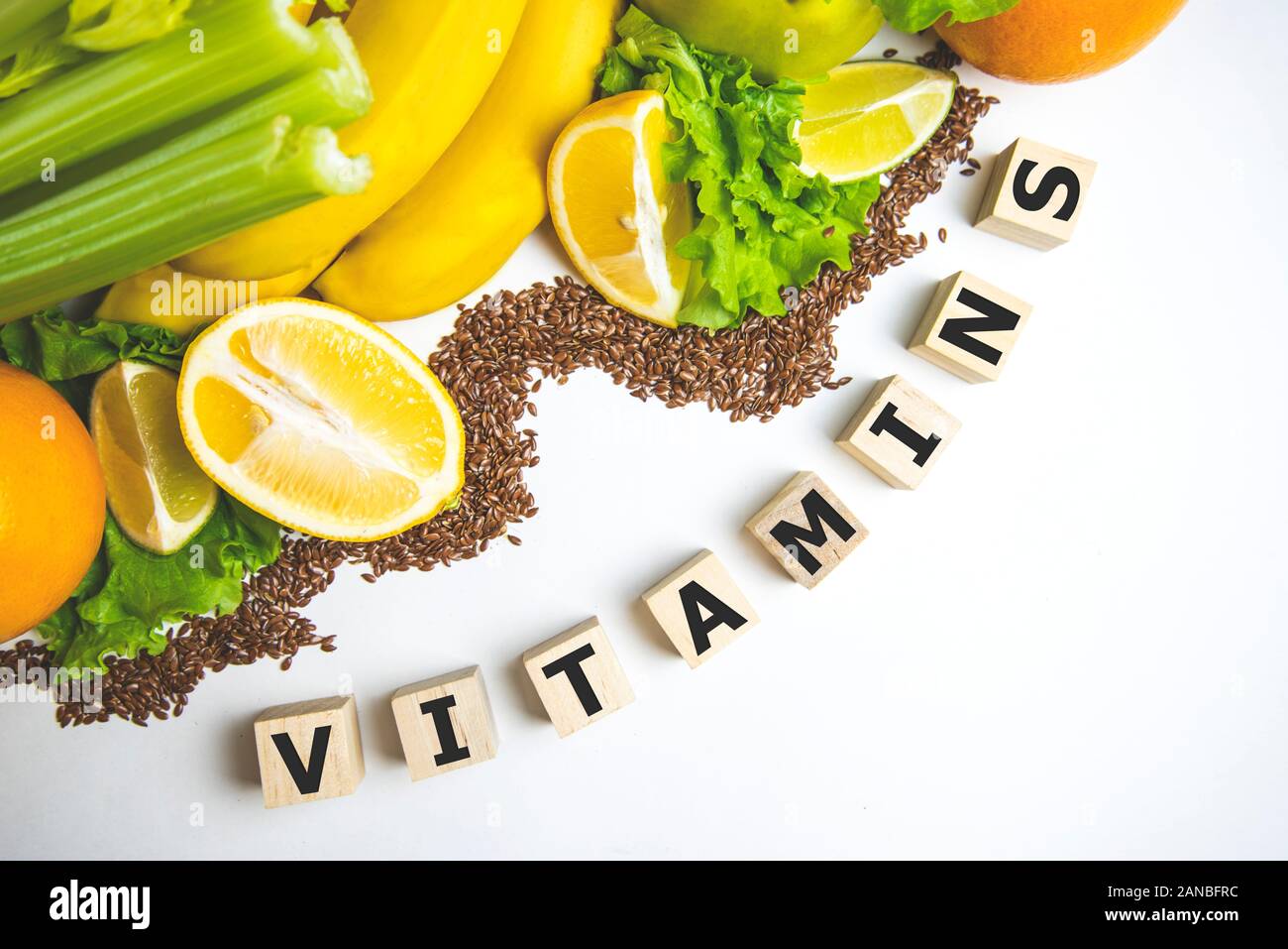 Vitamins word on wodden cubes on fruit background, top viev concept ...