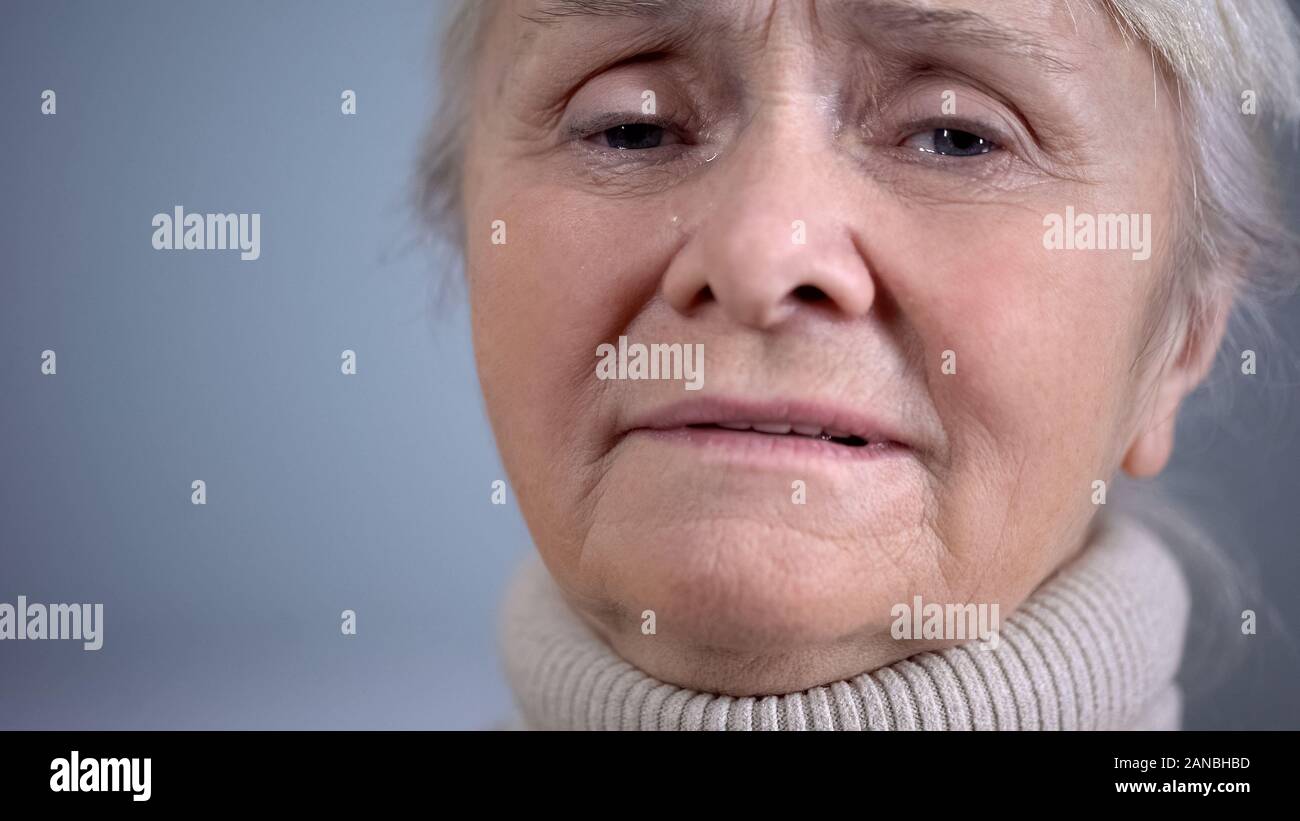Face of depressed crying old woman, social insecurity, health problems ...