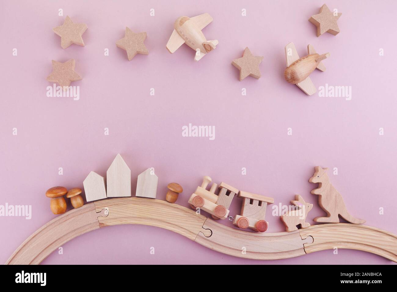 Zero waste. Eco wooden toys on pink background. Flat lay. Top view ...