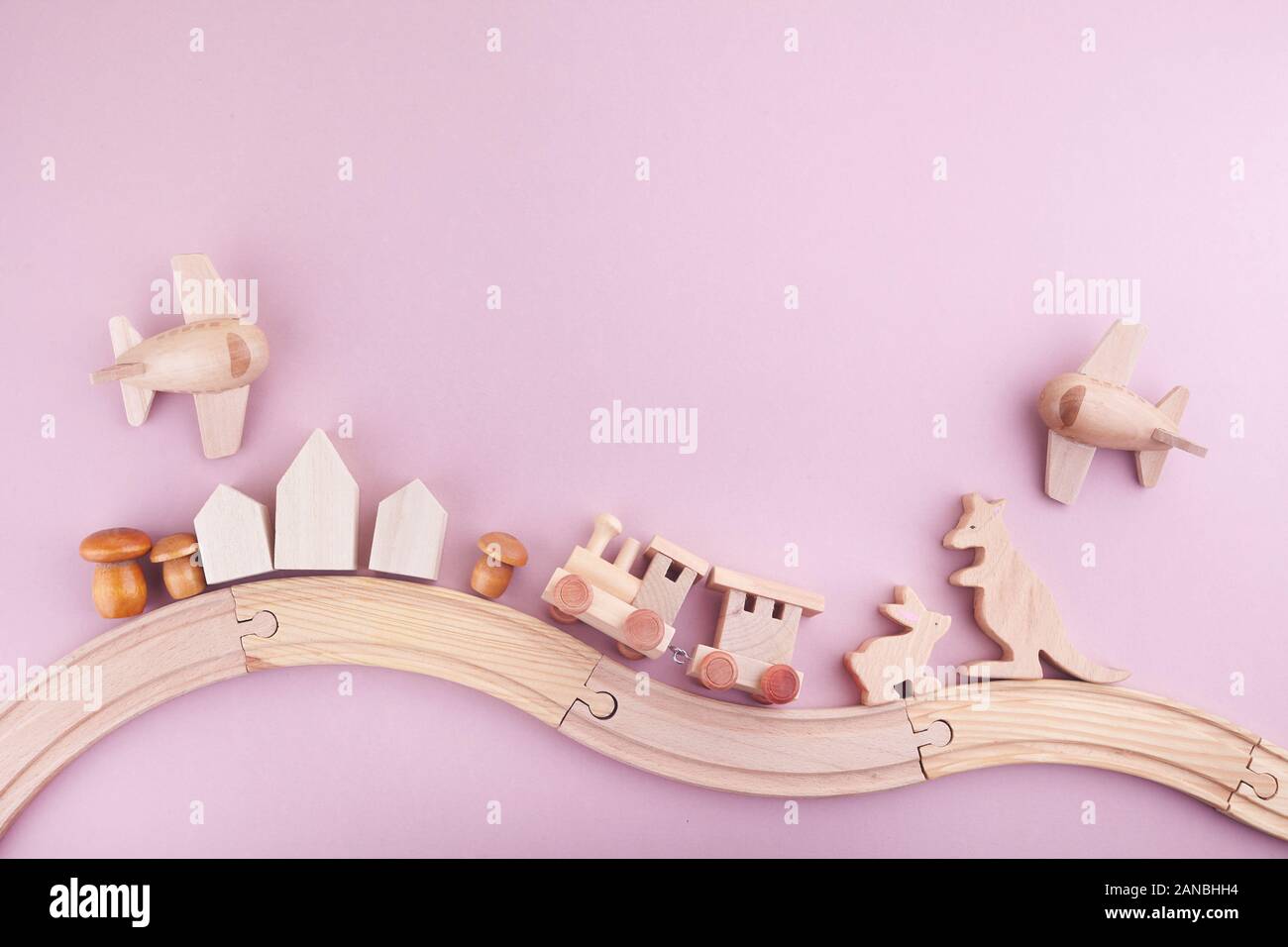 Zero waste. Eco wooden toys on pink background. Flat lay. Top view ...
