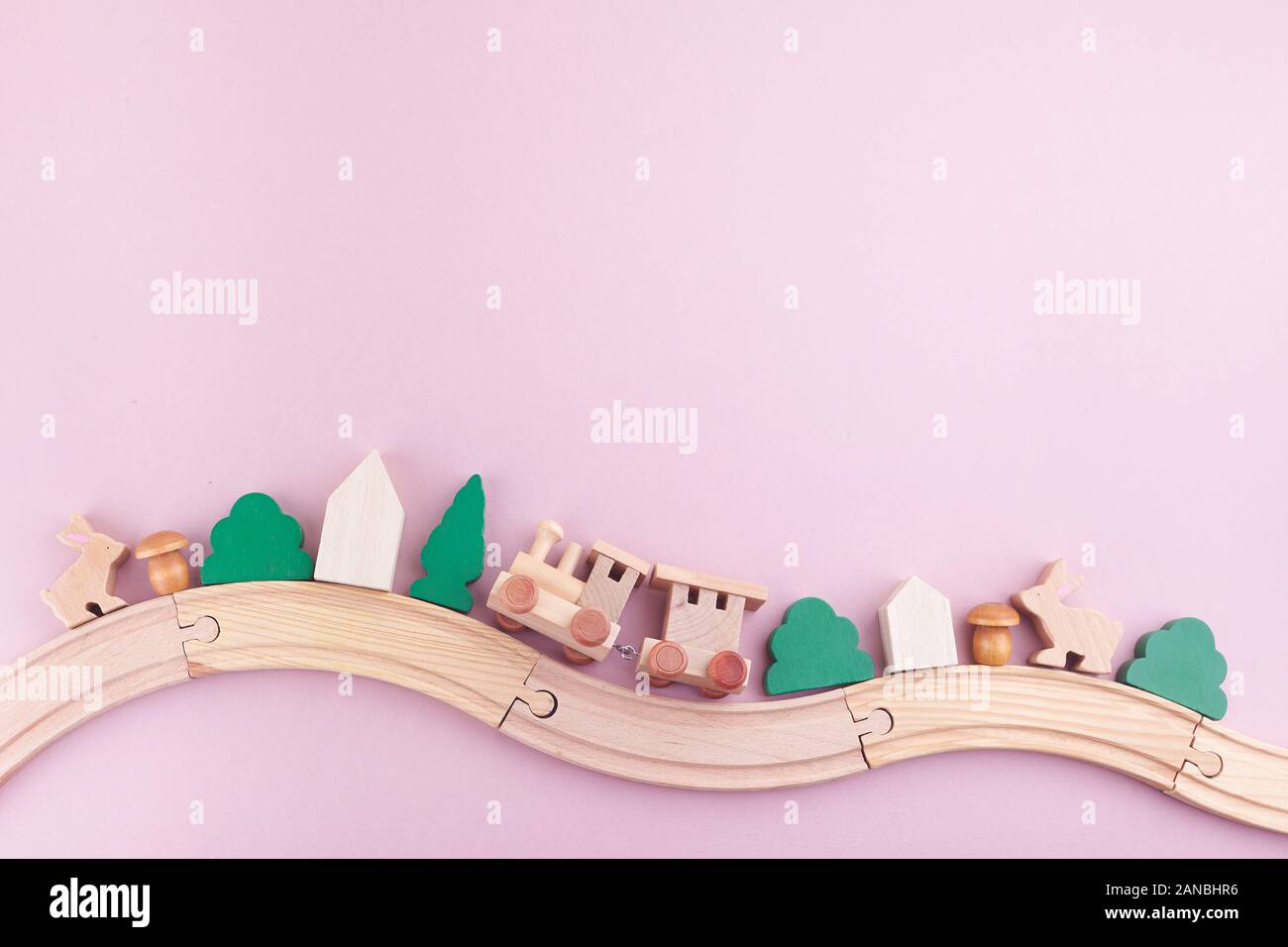 Zero waste. Eco wooden toys on pink background. Flat lay. Top view ...