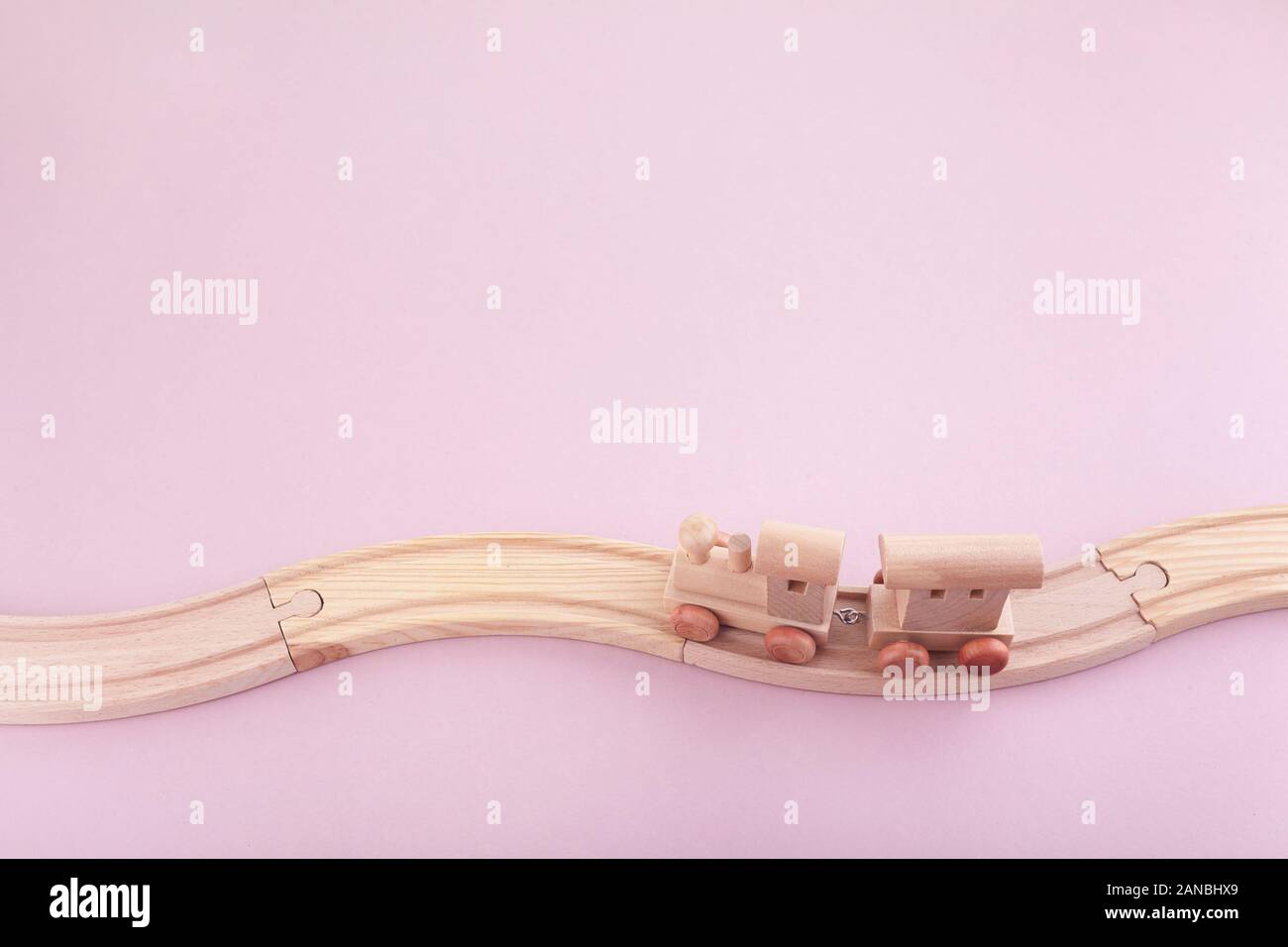 Zero waste. Eco wooden toys on pink background. Top view Stock Photo ...