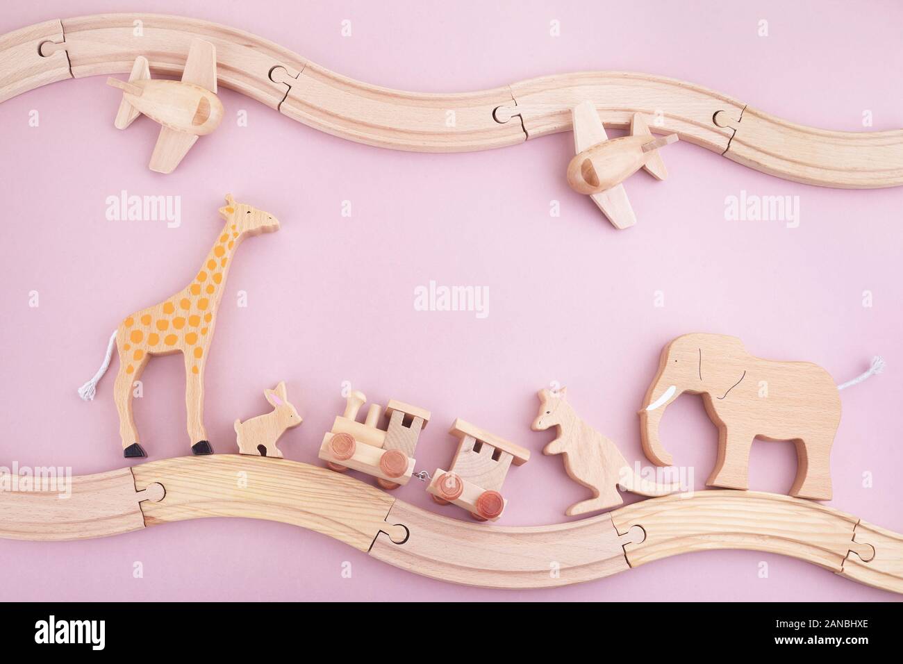 Zero waste. Frame from eco wooden toys on pink background. Flat lay ...