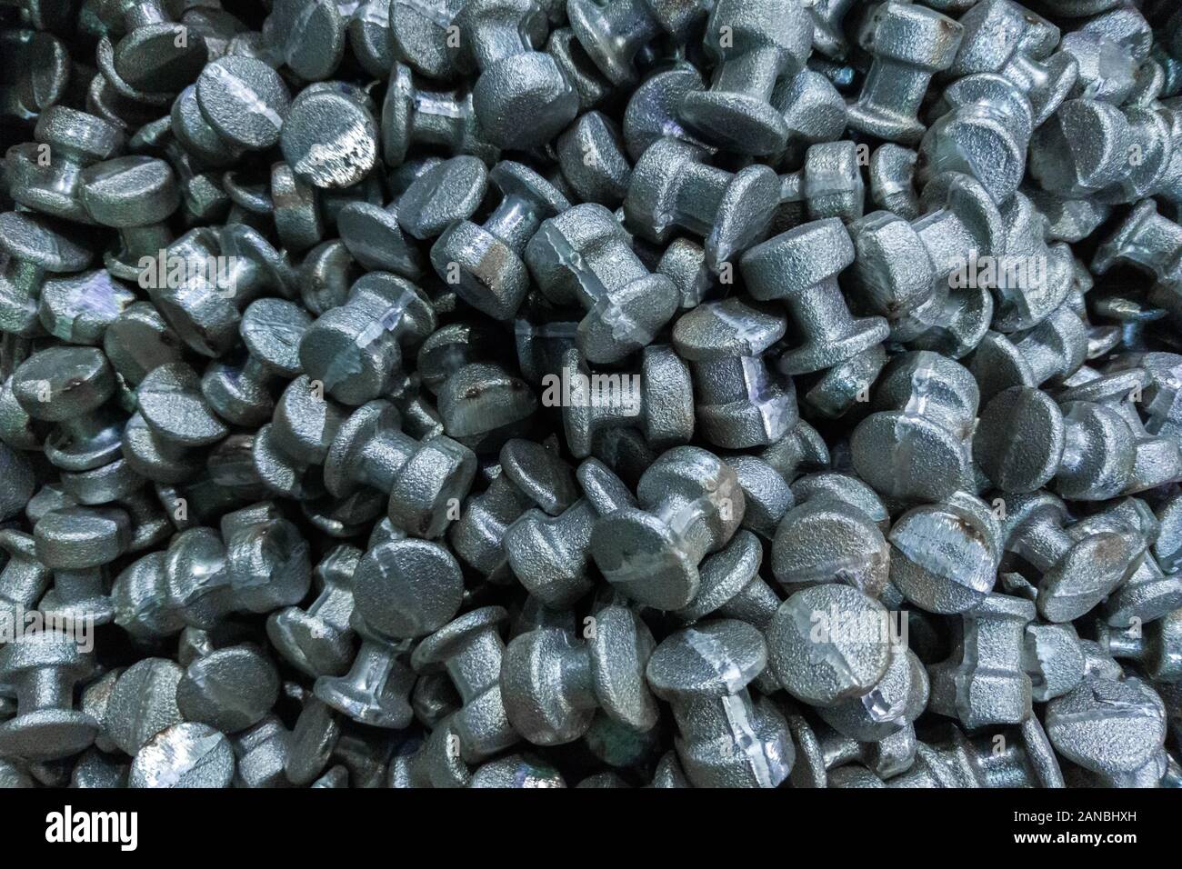 An abstract industrial full frame background of forged and sanded steel ...