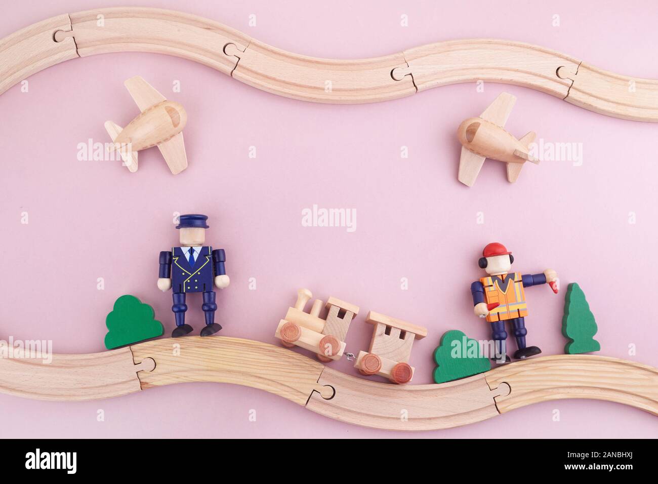 Zero waste. Frame from eco wooden toys on pink background. Flat lay ...