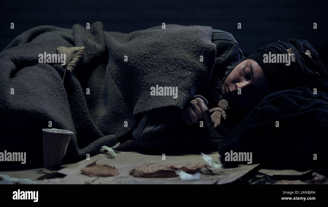 Homeless child sleeping on street hi-res stock photography and images ...