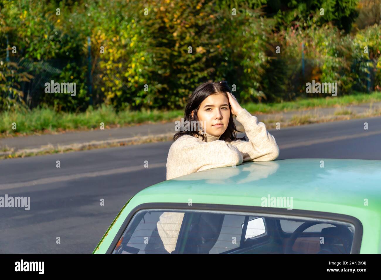Girl on car roof hi-res stock photography and images - Alamy