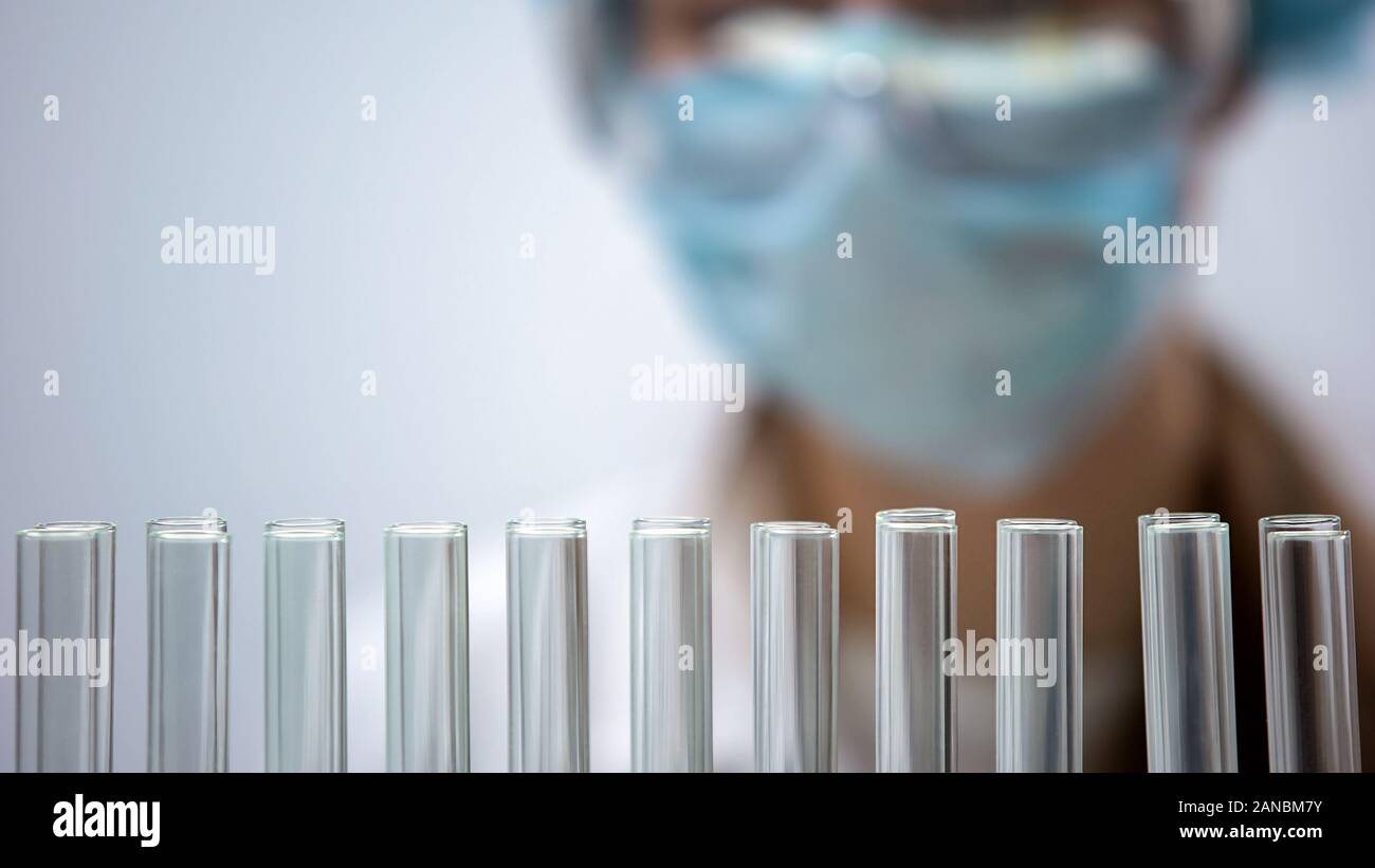 Empty test tubes with laboratory worker background, science experiment ...
