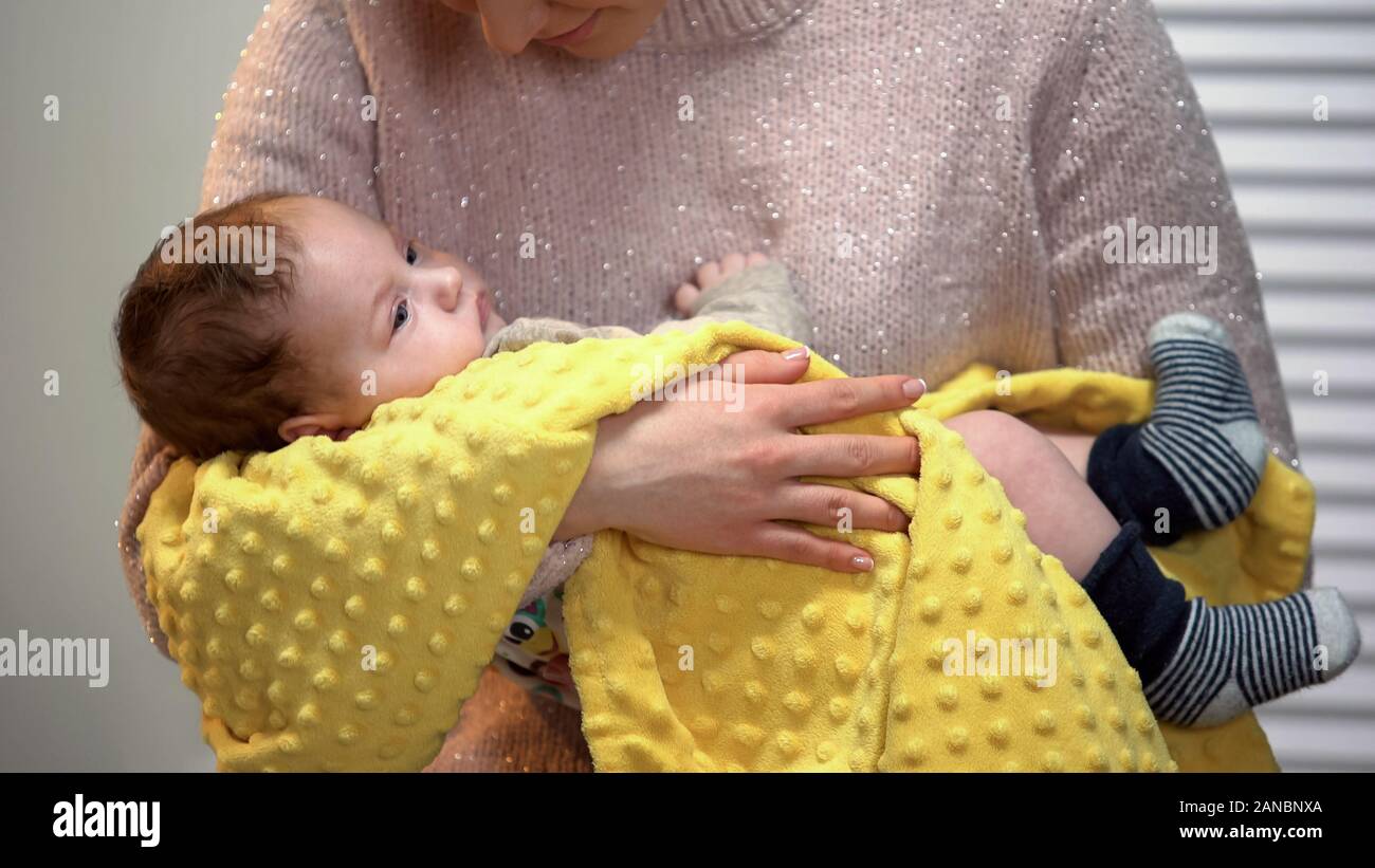 Woman singing to baby hi-res stock photography and images - Alamy