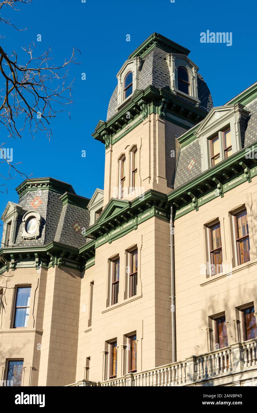 Exterior of old mansion in the Midwest with blue skies in the ...