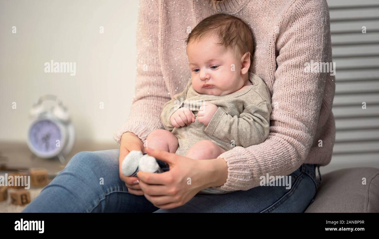 Little boy sitting on mother lap hi-res stock photography and images ...