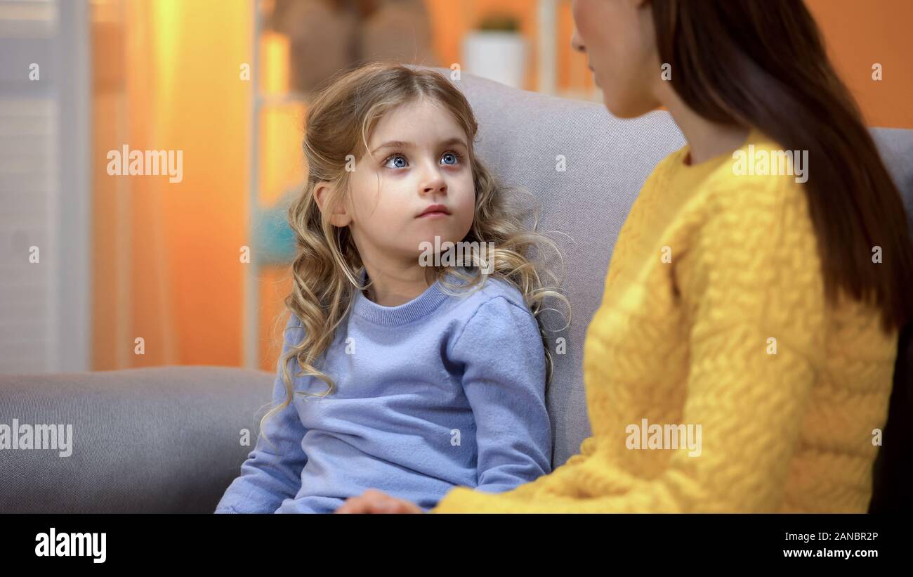 Mom explaining to child serious hi-res stock photography and images - Alamy