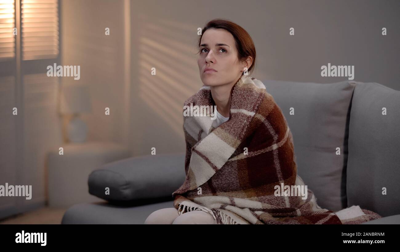 Miserable woman covered in plaid praying to God, experiencing life ...