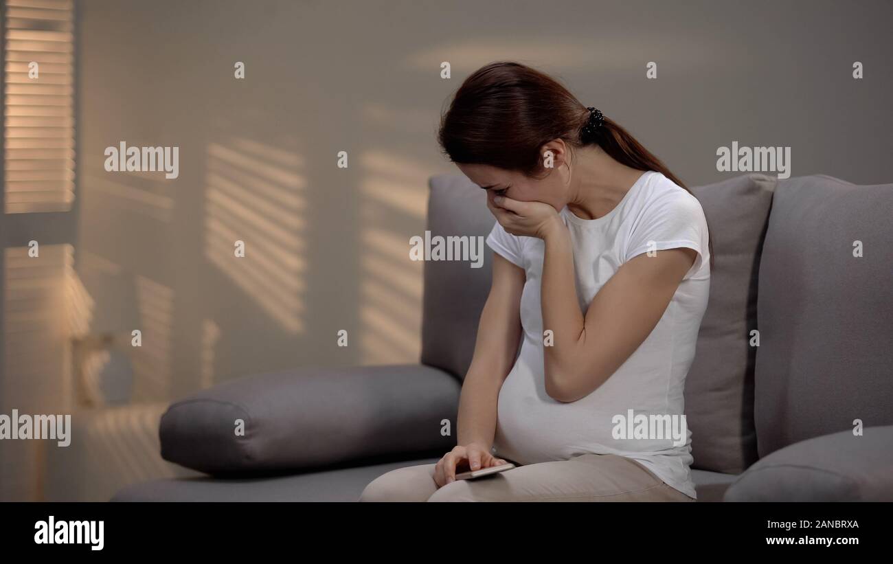 Crying pregnant woman hi-res stock photography and images - Alamy
