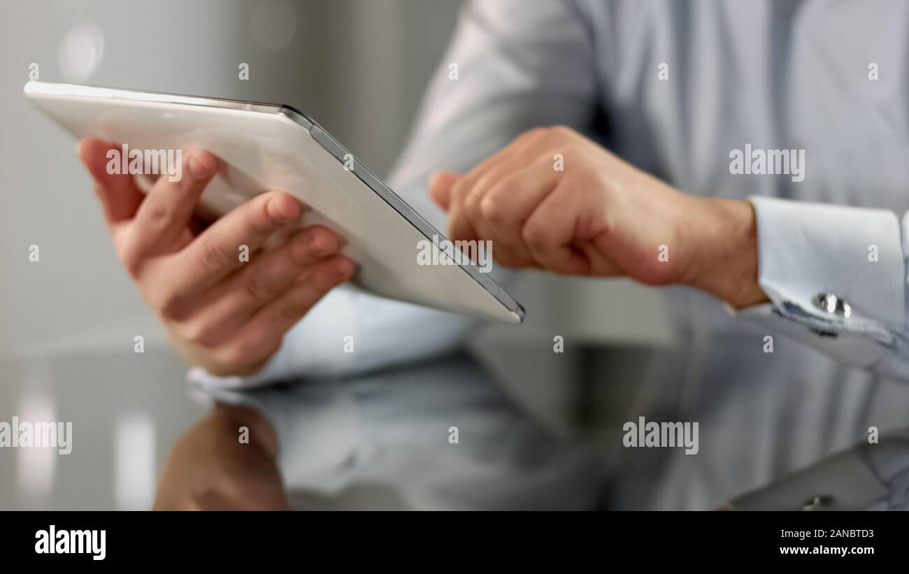 Office employee working tablet, preparing presentation, business ...