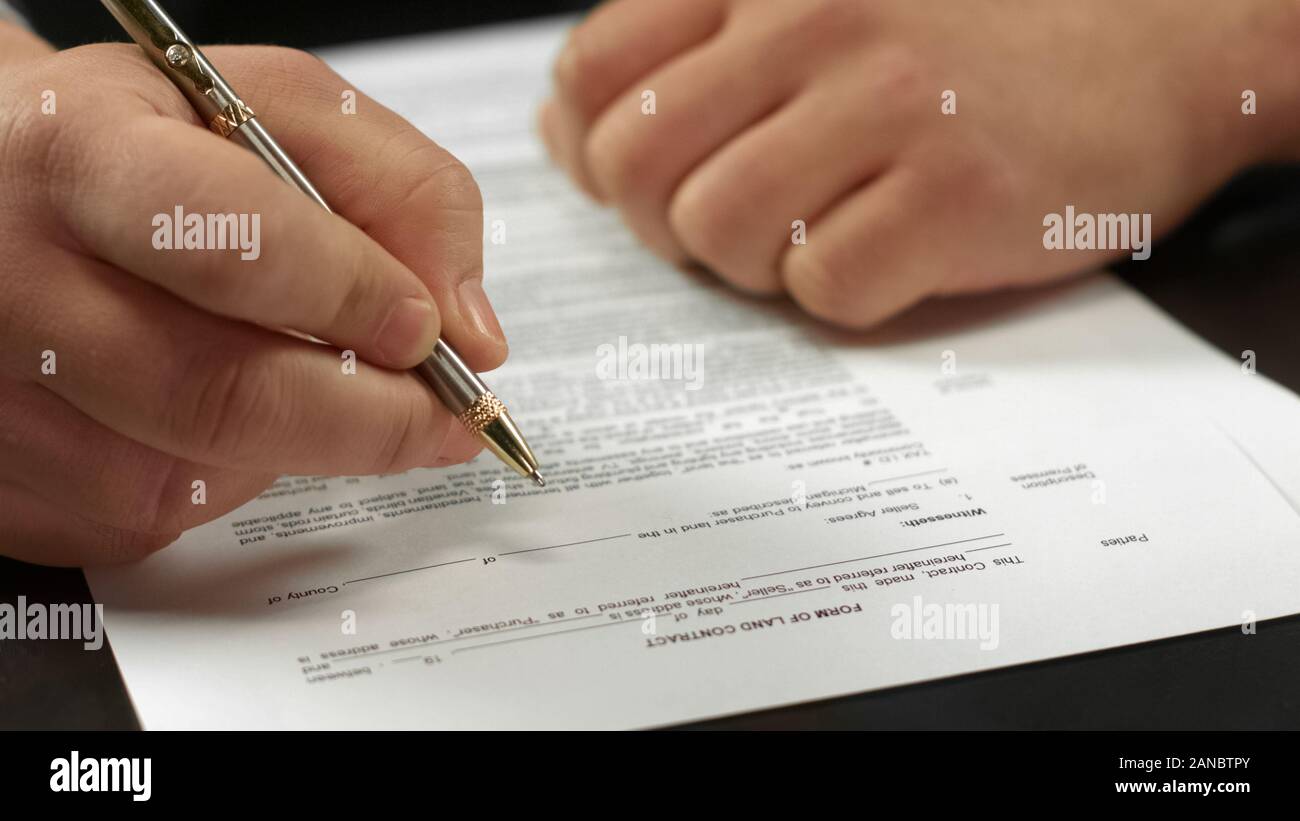 Male hand signing contract closeup, businessman making deal, agreement ...