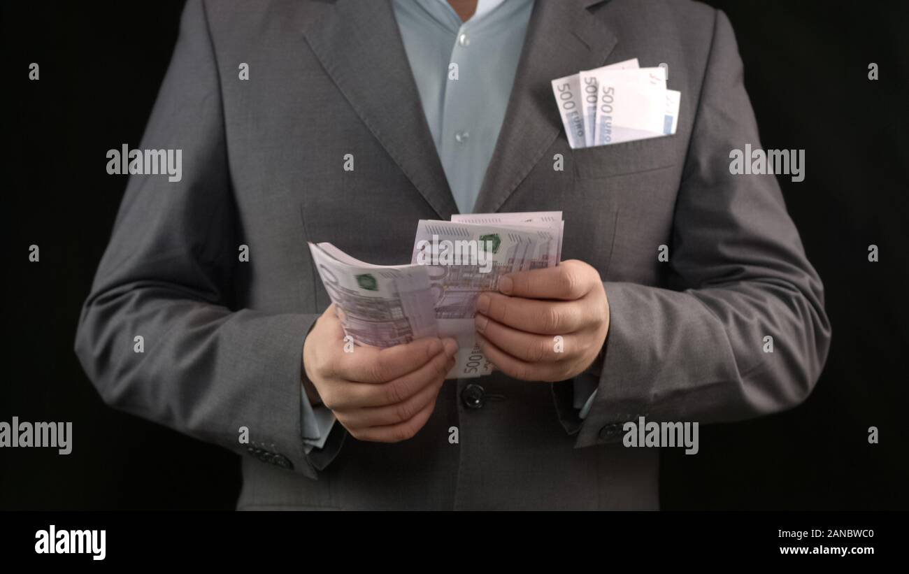 Counting paper money hi-res stock photography and images - Alamy