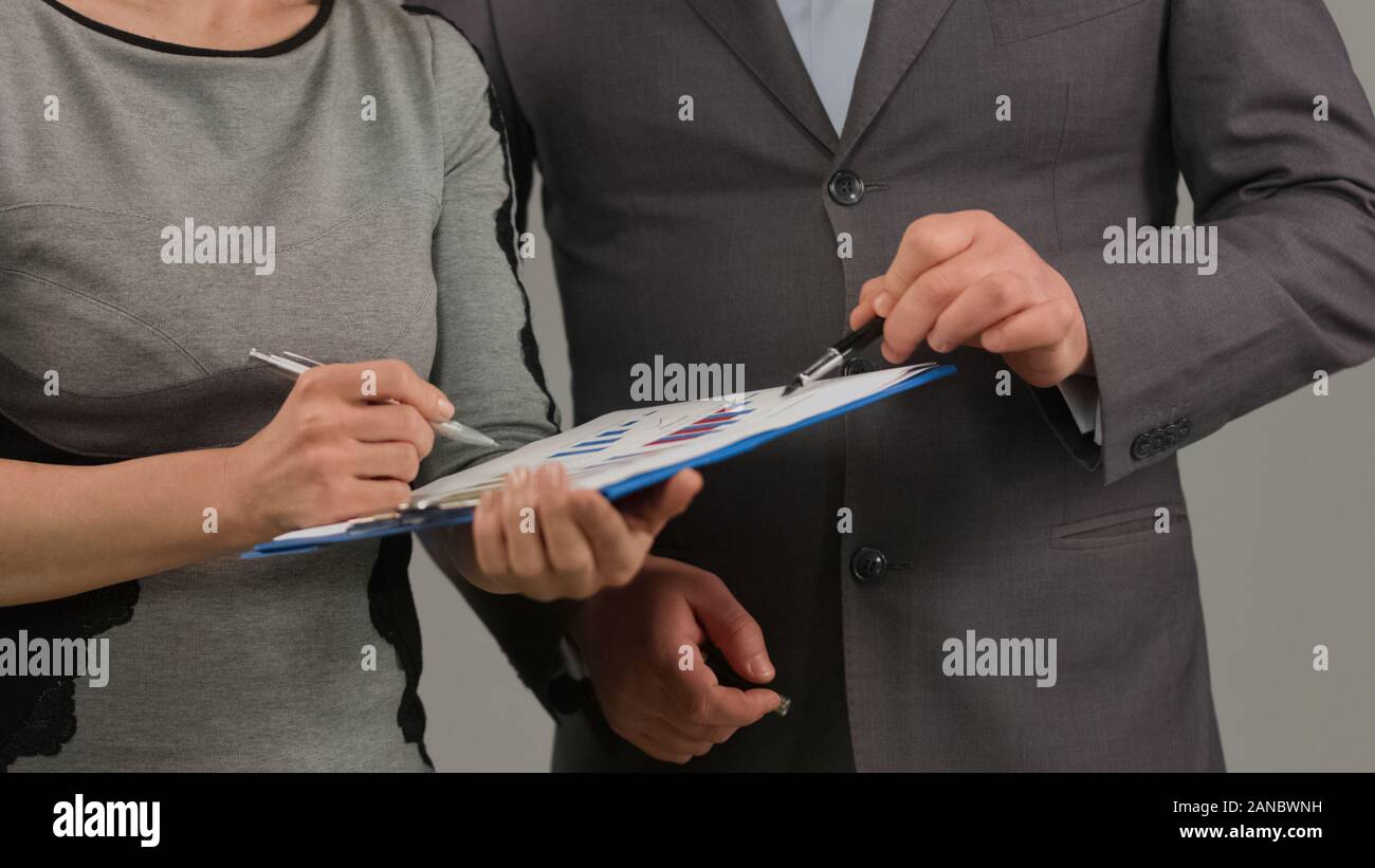 Male boss checking report on hi-res stock photography and images - Alamy