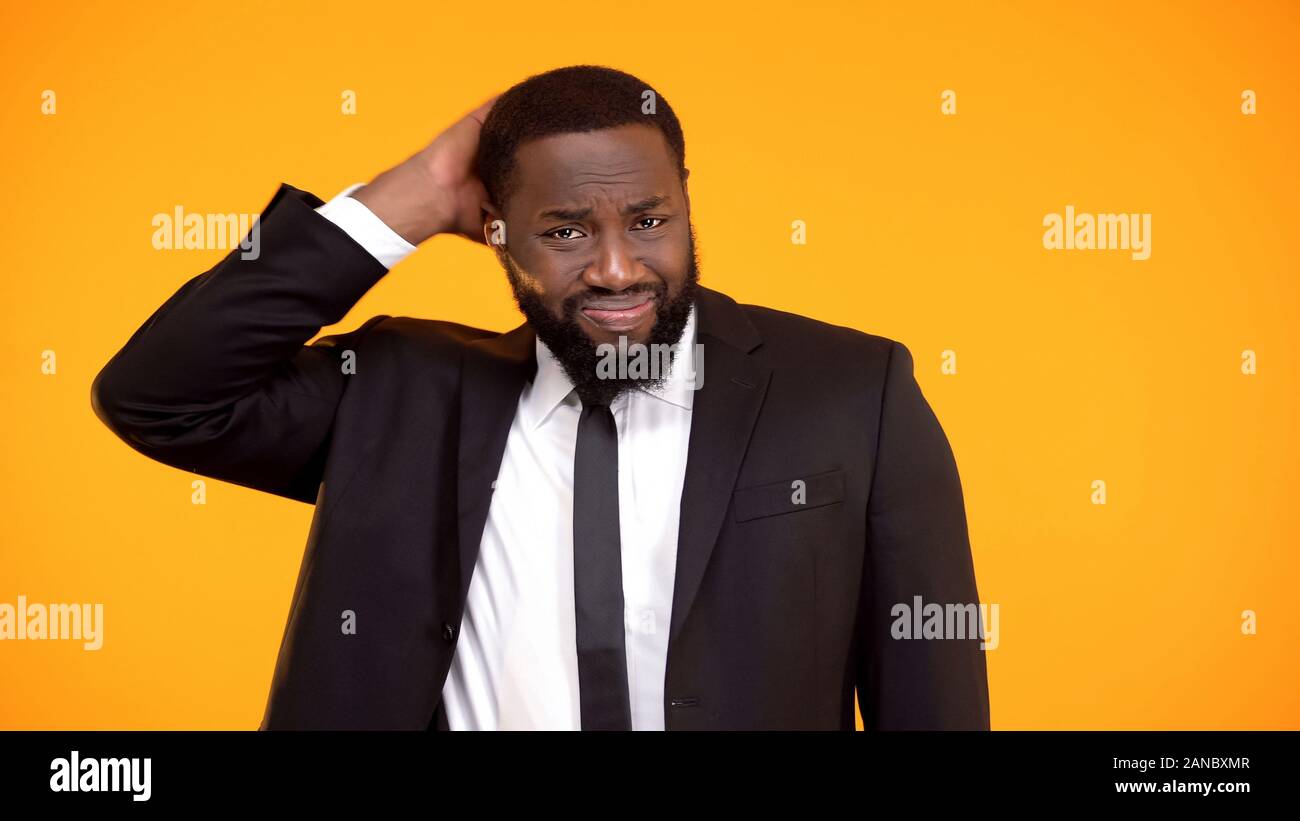 Office worker scratching head hi-res stock photography and images - Alamy