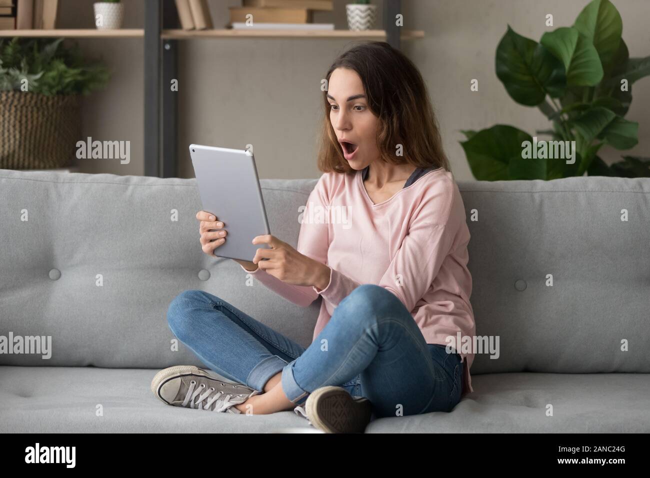 Surprised millennial woman received email with unexpected news Stock ...