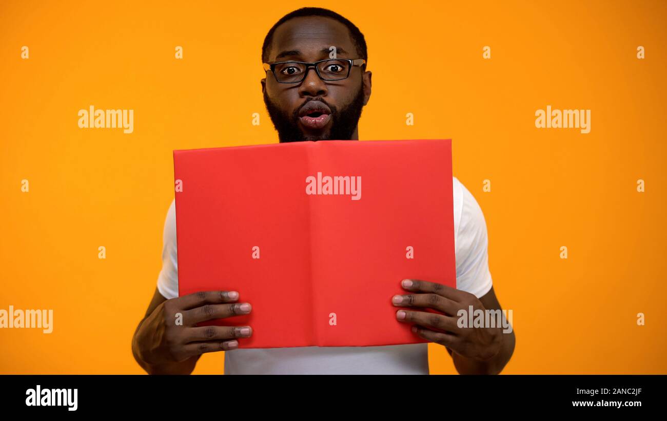 Man reading book from behind hi-res stock photography and images - Alamy