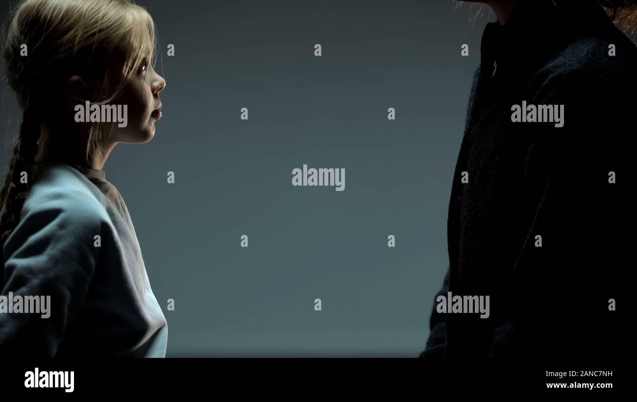 Little girl looking at adult woman, orphan child finding mother ...