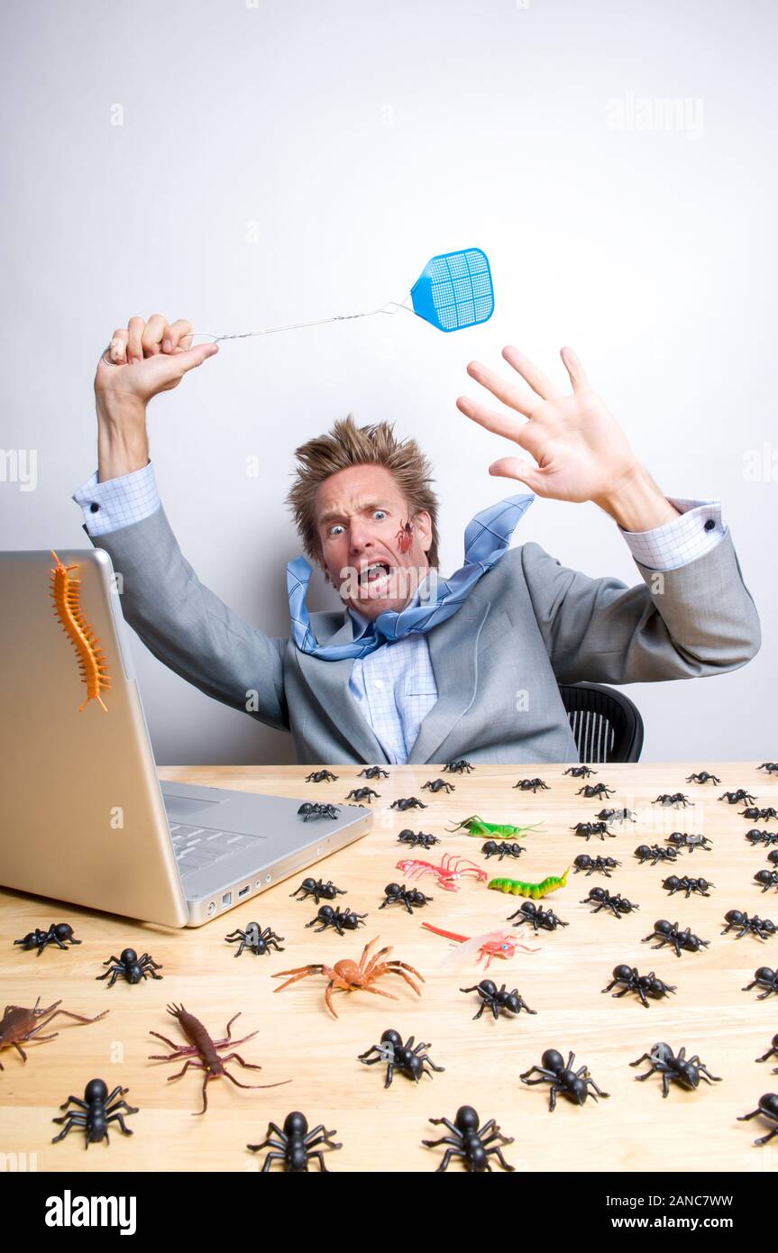 Frightened computer programmer freaking out at an onslaught of bugs ...