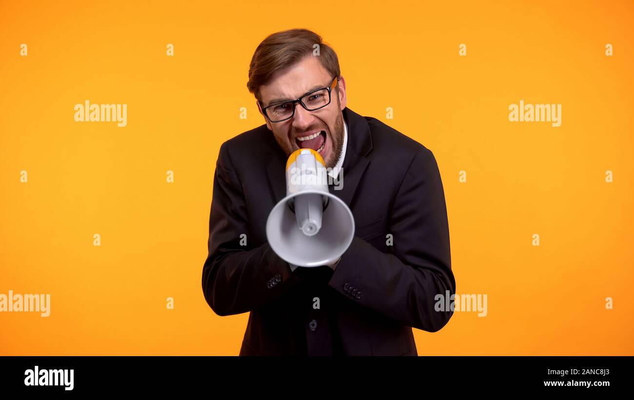Angry boss shouting at employees using megaphone, harassment at work ...