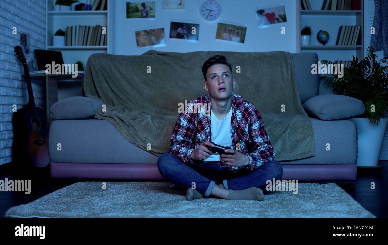 Student playing video games late at night instead studying, game ...