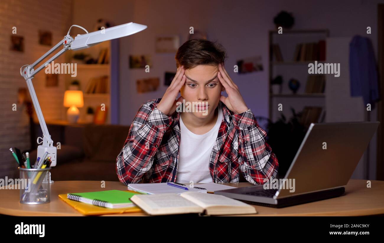 Teen student cant concentrate to make hard math assignment, test ...