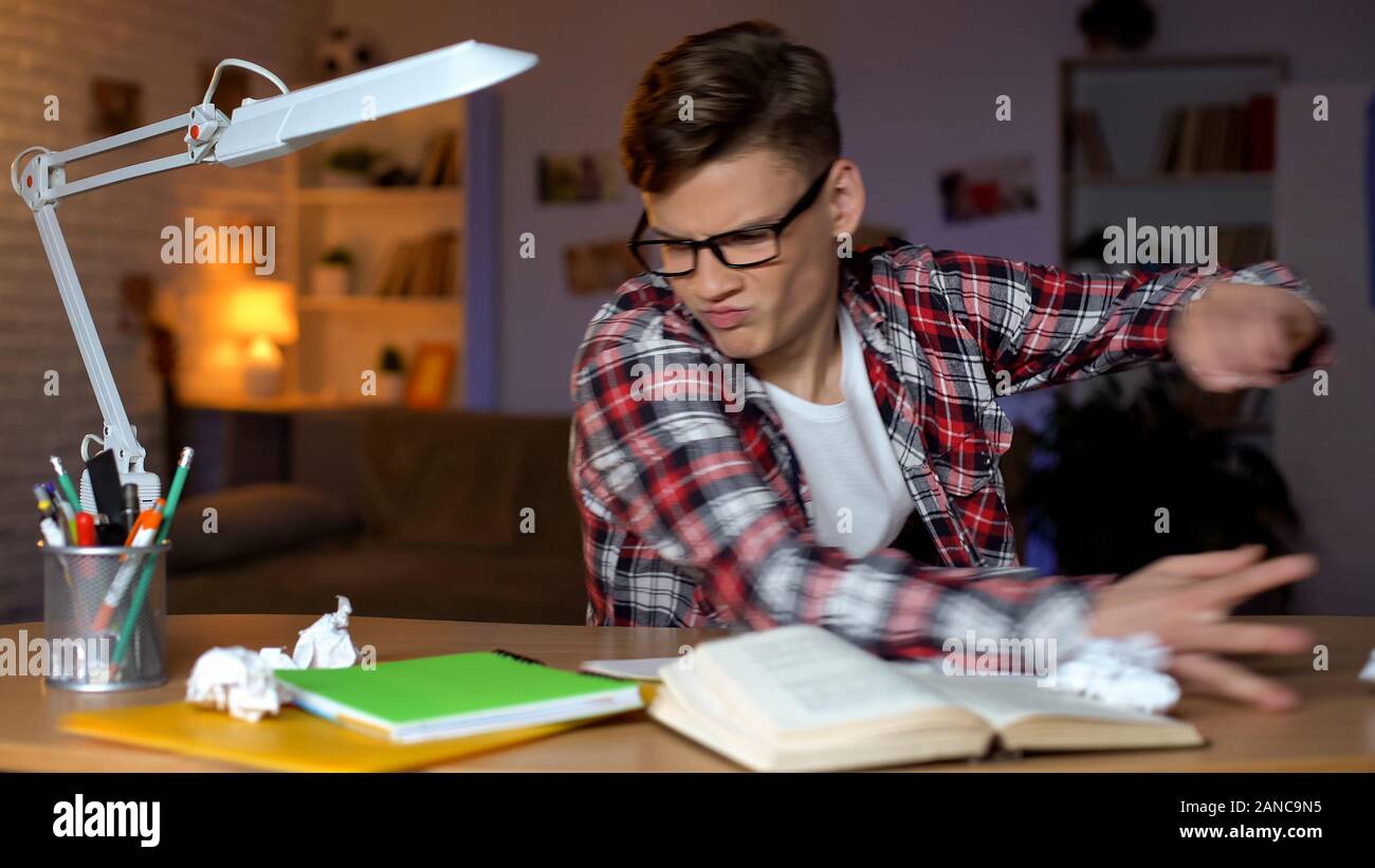 Aggressive student throwing books of table, cannot solve assignment ...