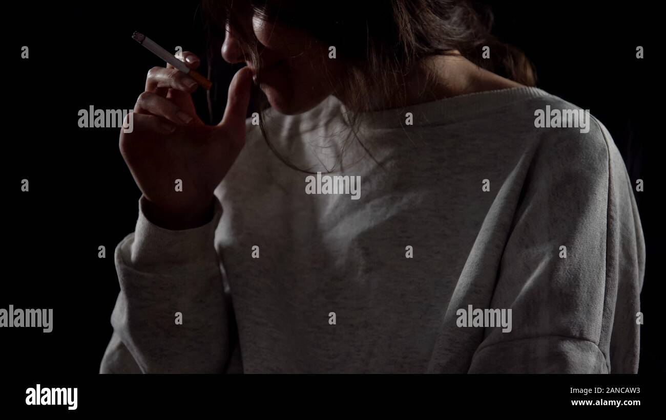 Woman smoking cigarette suffering depression, thinking about life ...