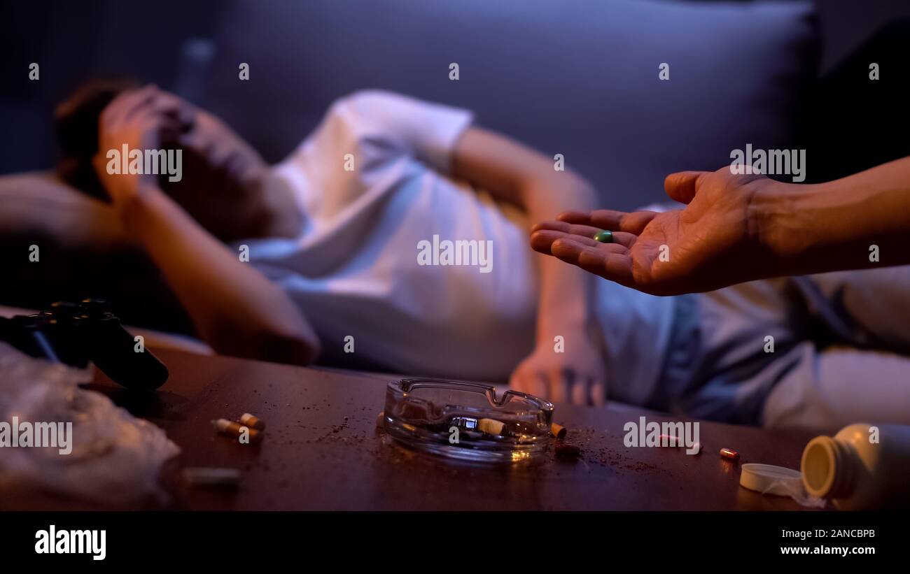 Offering drugs to student hi-res stock photography and images - Alamy